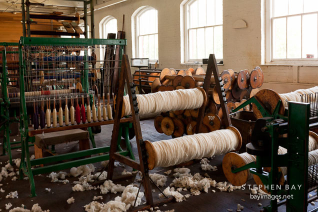 Photo: Spools holding wool roving. Thomas Kay Woolen Mill, Salem, Oregon.